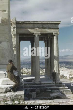 Sergeant R. Gregory photographs Driver A. Hardman at the Erechtheum ...