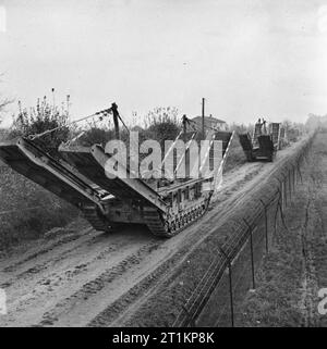 Churchill ARK bridgelaying tanks of the British Army are shown passing ...