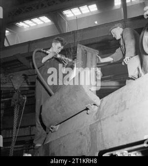 In 1942, fitter Geoffrey Hartley grinds the hind louvres of a Matilda ...
