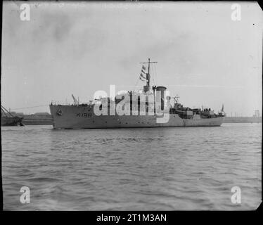 HMS Cowslip is underway while being towed, indicating the vessel is in ...