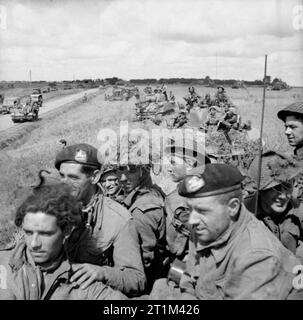 British infantry and Sherman tanks wait to advance at the start of ...