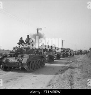 A Crusader tank of the 22nd Armoured Brigade returning after action in ...