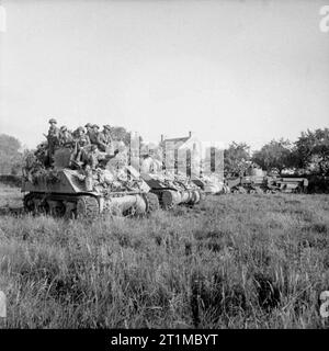 British infantry and Sherman tanks wait to advance at the start of ...