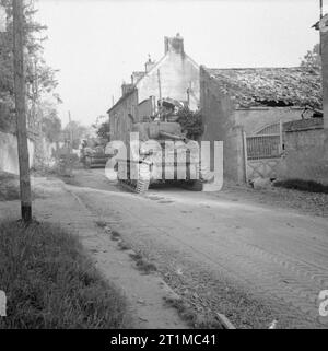 Sherman Firefly tanks move through the ruins of Kleve on their way to ...