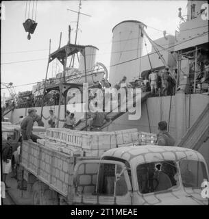 THE BRITISH ARMY ON MALTA 1942 - Soldiers loading oil drums onto a ...