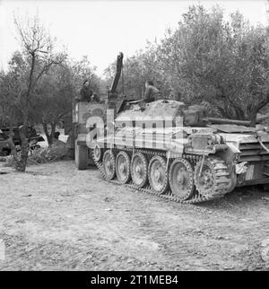 A Scammell Pioneer recovery lorry tows a disabled Crusader tank into a ...