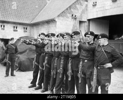 Men of 4th Royal Tank Regiment practising with their .38 revolvers in a ...