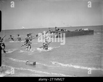 Royal Navy beach parties and commandos training with landing craft at ...