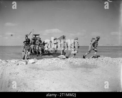 Royal Navy beach parties and commandos training with landing craft at ...
