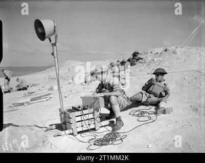 Royal Navy beach parties and commandos training with landing craft at ...