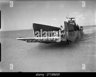 Royal Navy beach parties and commandos training with landing craft at ...