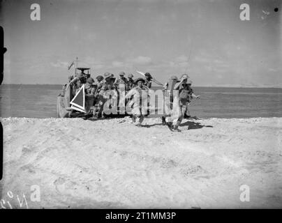 Royal Navy beach parties and commandos training with landing craft at ...