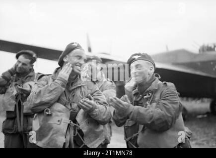 Paratroops of 6th Airborne Division blackening their faces in front of ...