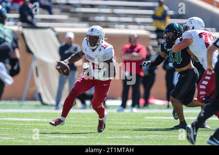 Temple quarterback Quincy Patterson runs after handing the ball off ...