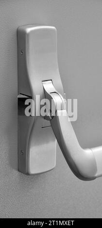 Emergency exit door. Closed up latch door handle of emergency exit ...