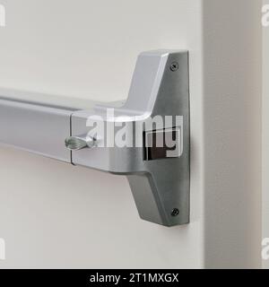 Emergency exit door. Closed up latch and black white door handle of ...
