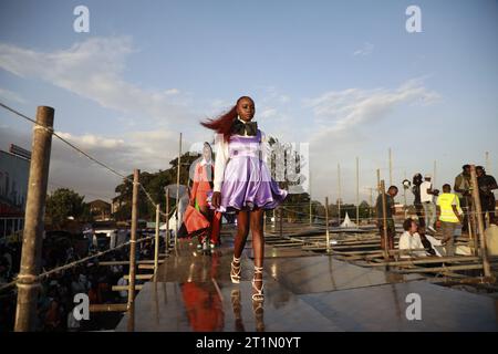 Nairobi, Kenya. 14th Oct, 2023. A model gets ready in backstage before ...
