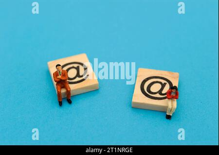 miniature figurines and email symbols Stock Photo - Alamy