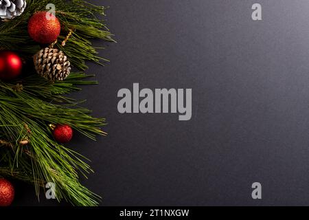 Colorful christmas baubles with fir tree branches on white background ...
