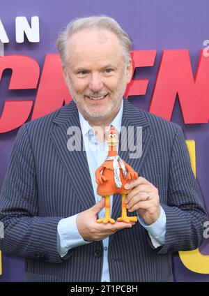 Nick Park with Chicken character Ginger and Peter Lord with Chicken ...