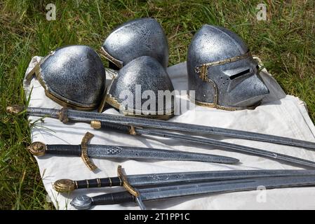 Medieval armor and swords and weapons on a wall display in Fussen ...