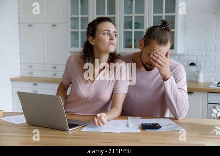Young man husband in budget planning concept Stock Photo - Alamy