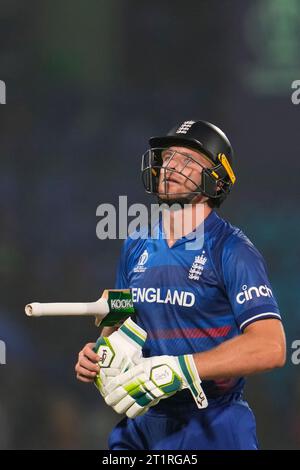 England's captain Jos Butler leaves the ground after losing his wicket ...