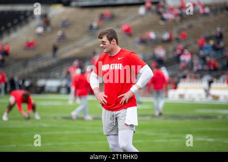 Ohio State quarterback Kyle McCord (6) runs past Purdue linebacker ...