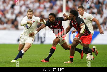 England's Elliot Daly and Fiji's Ilaisa Droasese go for the ball during ...