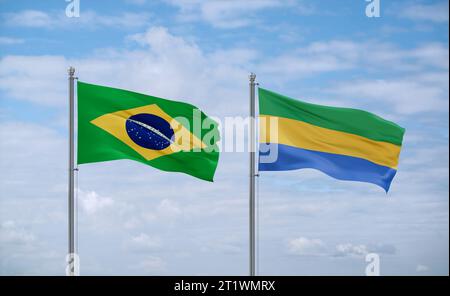Brazil and Gabon flags waving together on blue cloudy sky, two country relationship concept ...