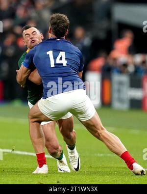 France's Damian Penaud is tackled by South Africa's Pieter-Steph du ...