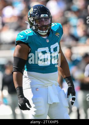Jacksonville Jaguars defensive end Jeremiah Ledbetter (98) loosens up ...