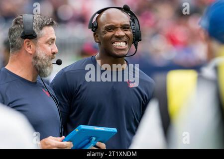 Houston Texans defensive coordinator Matt Burke signals to players ...