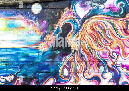 Seafront graffiti on a seawall at Herne Bay. An explosion ball of ...