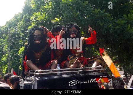 portrait of 3 men dressed up as giant, scary puppet characters with big ...
