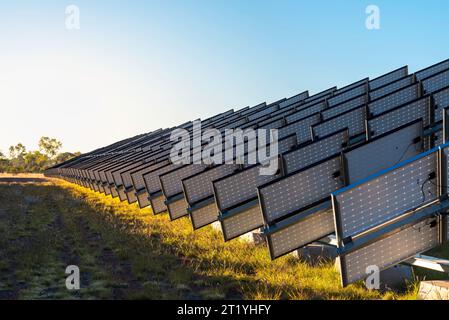 Solar power station in arid area under clear blue sky. Solar power ...