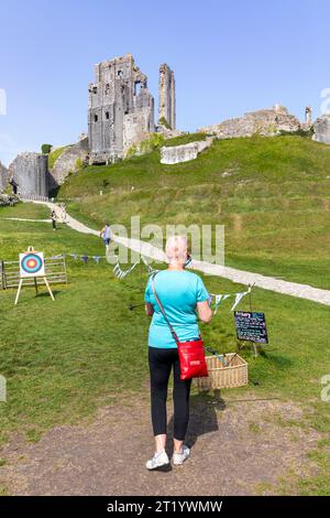 Corfe Castle Dorset, model released woman using bow and arrow at the ...