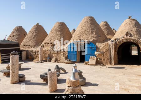 Traditional Syrian "beehive" house in the desert beside the road ...