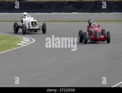 A 1938 Maserati 6CM leads a 1936 ERA B-type R9B racing car at the 2023 ...