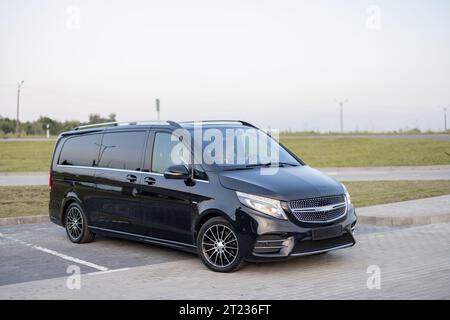 Black luxury minivan taxi Stock Photo - Alamy