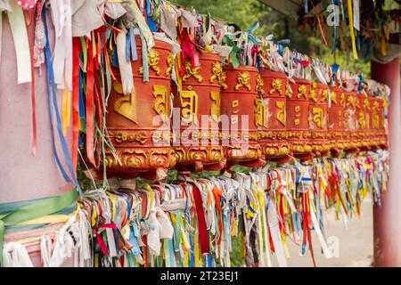 Rotating religious elements for touching turning spinning Buddhist ...