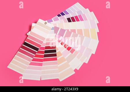 Many color palettes on pink background Stock Photo - Alamy