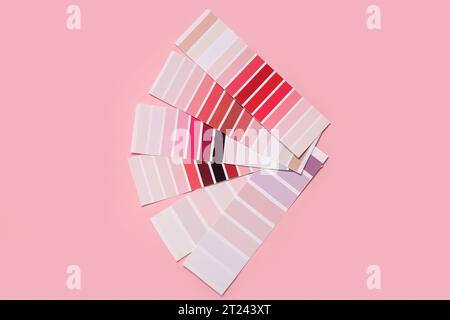 Many color palettes on pink background Stock Photo - Alamy