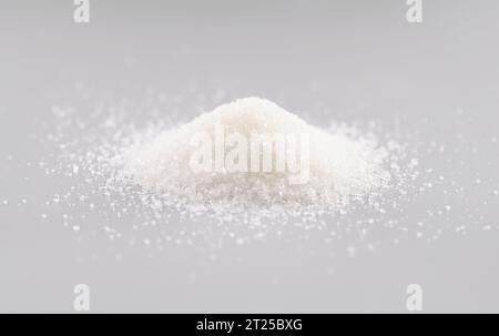 Sugar crystals pile on grey background, heap of sweet powder, sugar ...