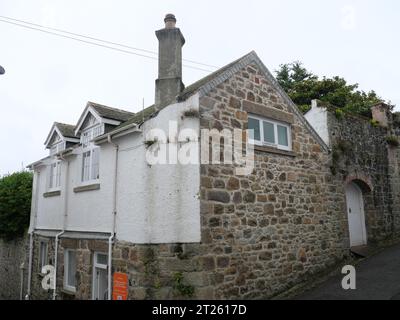 Old corner house with fieldstone wall in St Ives in Cornwall England ...
