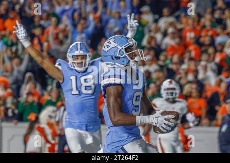 North Carolina tight end Bryson Nesbit runs a drill at the NFL football ...