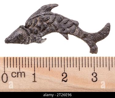 Malayan tin coin in the form of a fish. Isolated on white Stock Photo ...