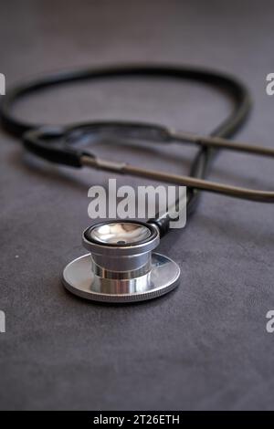 Black stethoscope on a dark surface with copy space for text Stock ...