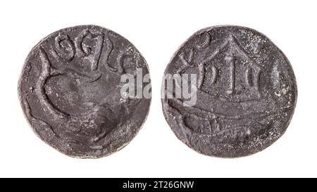 An ancient tin-zinc Siamese coin depicting a giant catfish. Obverse ...