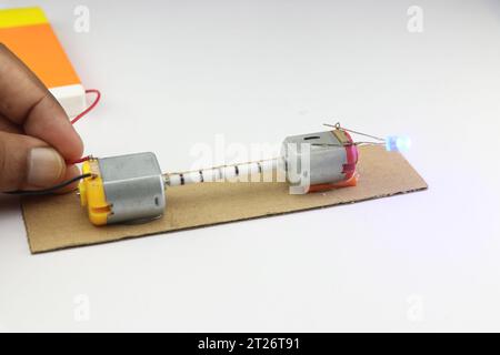 DC motor shafts connected to each other to show the concept of energy ...